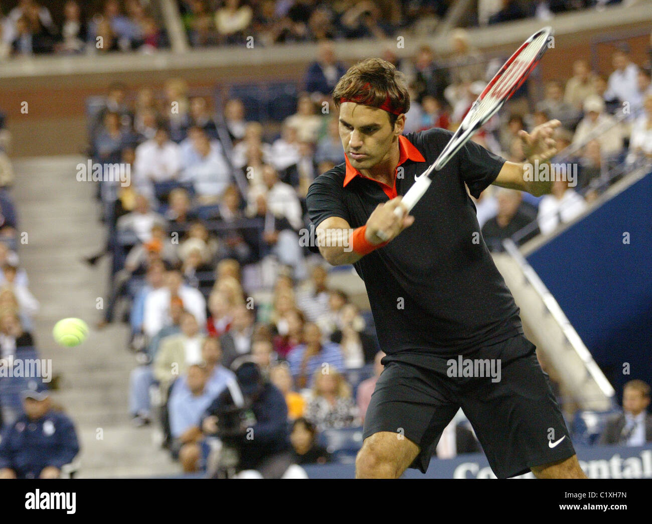 Roger Federer of Switzerland in action against Simon Greul of Germany ...