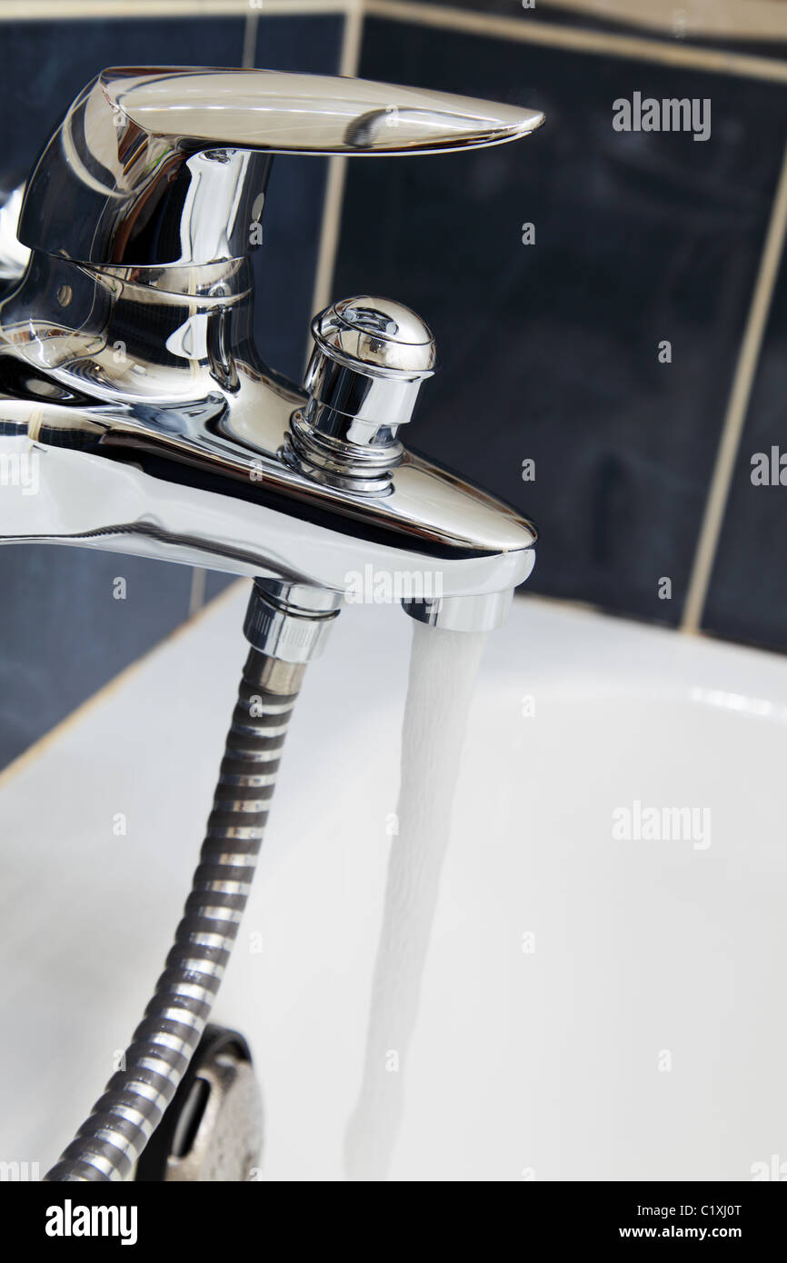 water stream flows from the faucet Stock Photo - Alamy