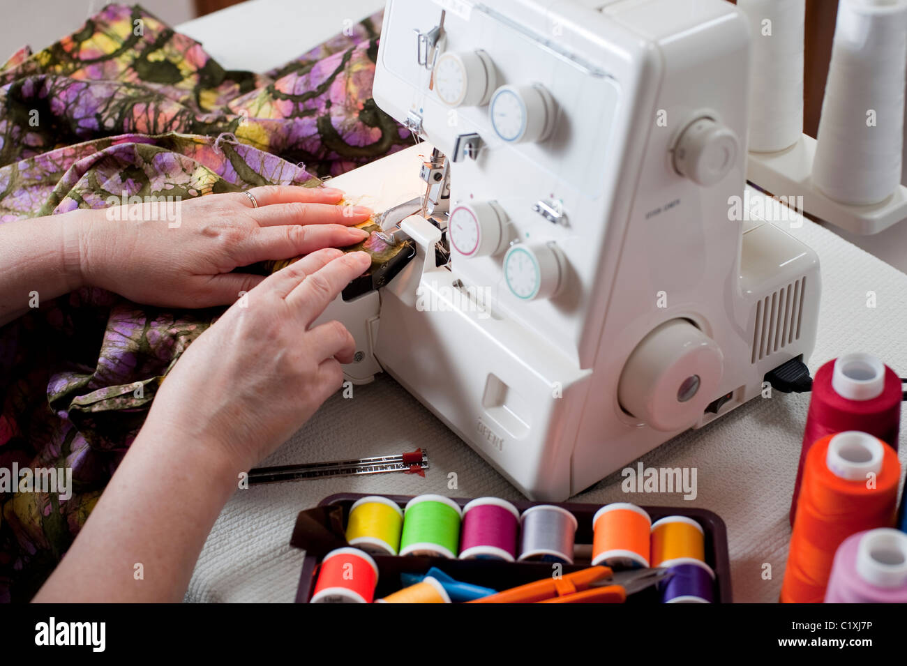 Women sewing with serger Stock Photo - Alamy