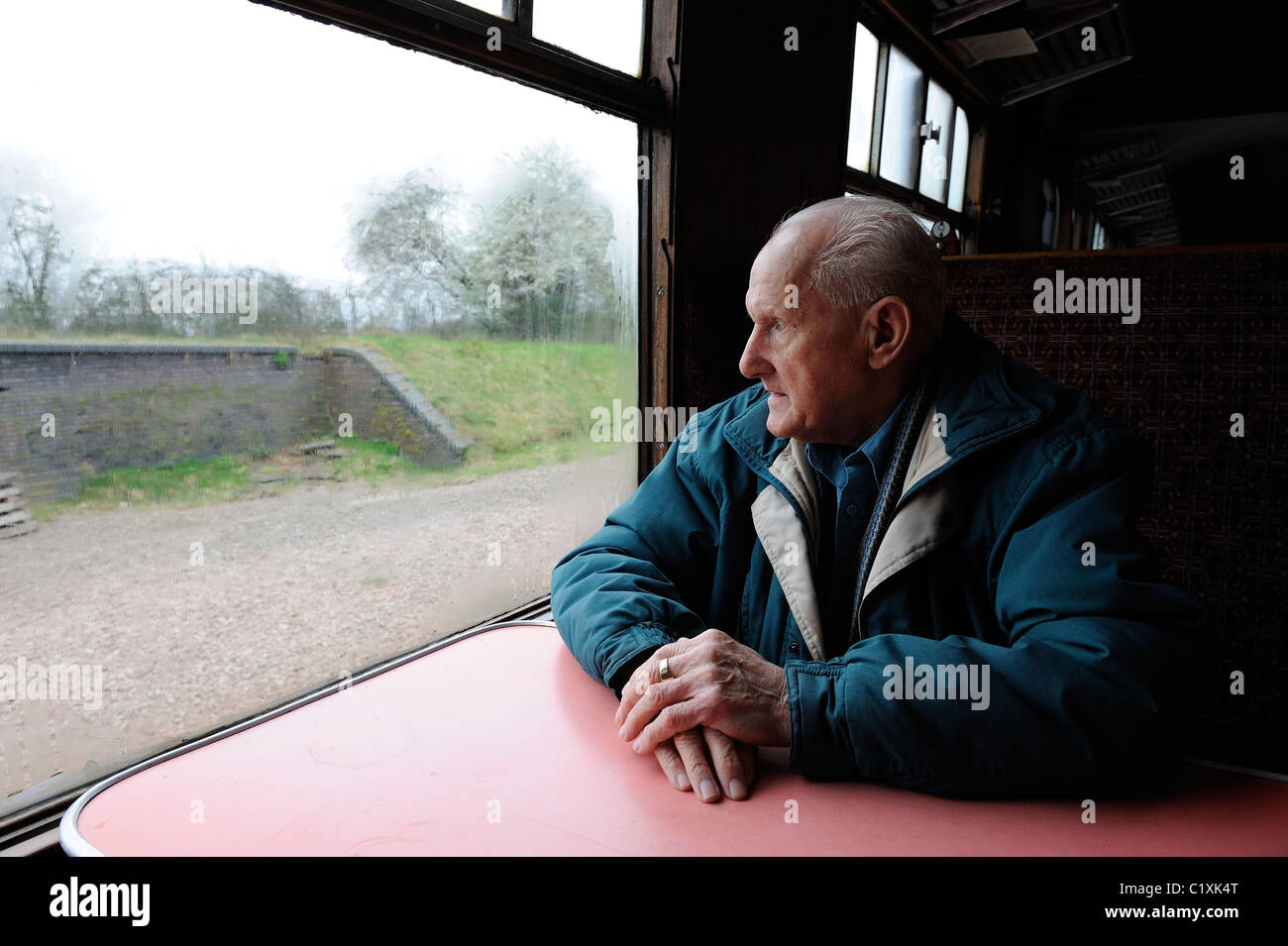 pensioner looking out of train window great central railway ...