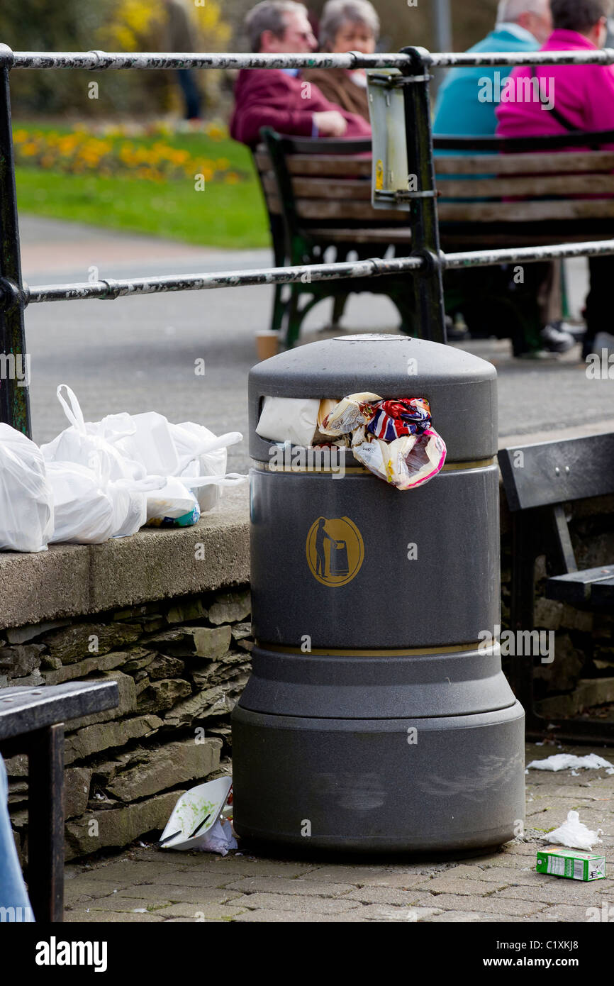 Over flowing litter bin on Bowness Bay front Stock Photo - Alamy
