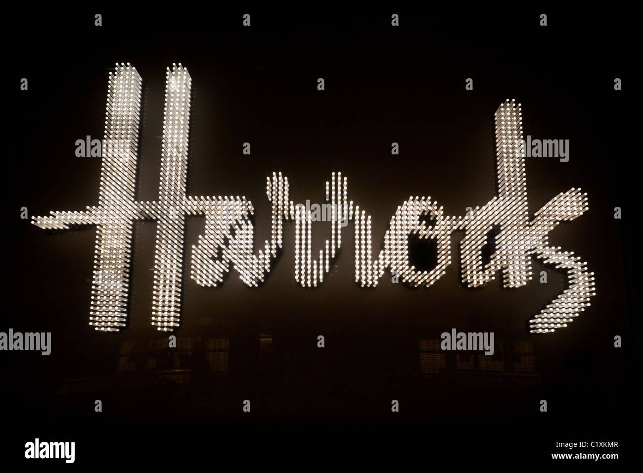 Harrods lit sign, terminal 5 Heathrow airport London UK Stock Photo - Alamy