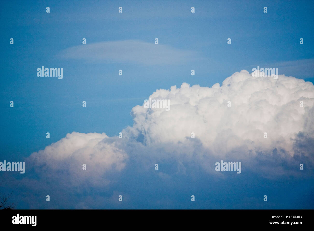 View of some cumulus white and fluffy type of clouds Stock Photo - Alamy