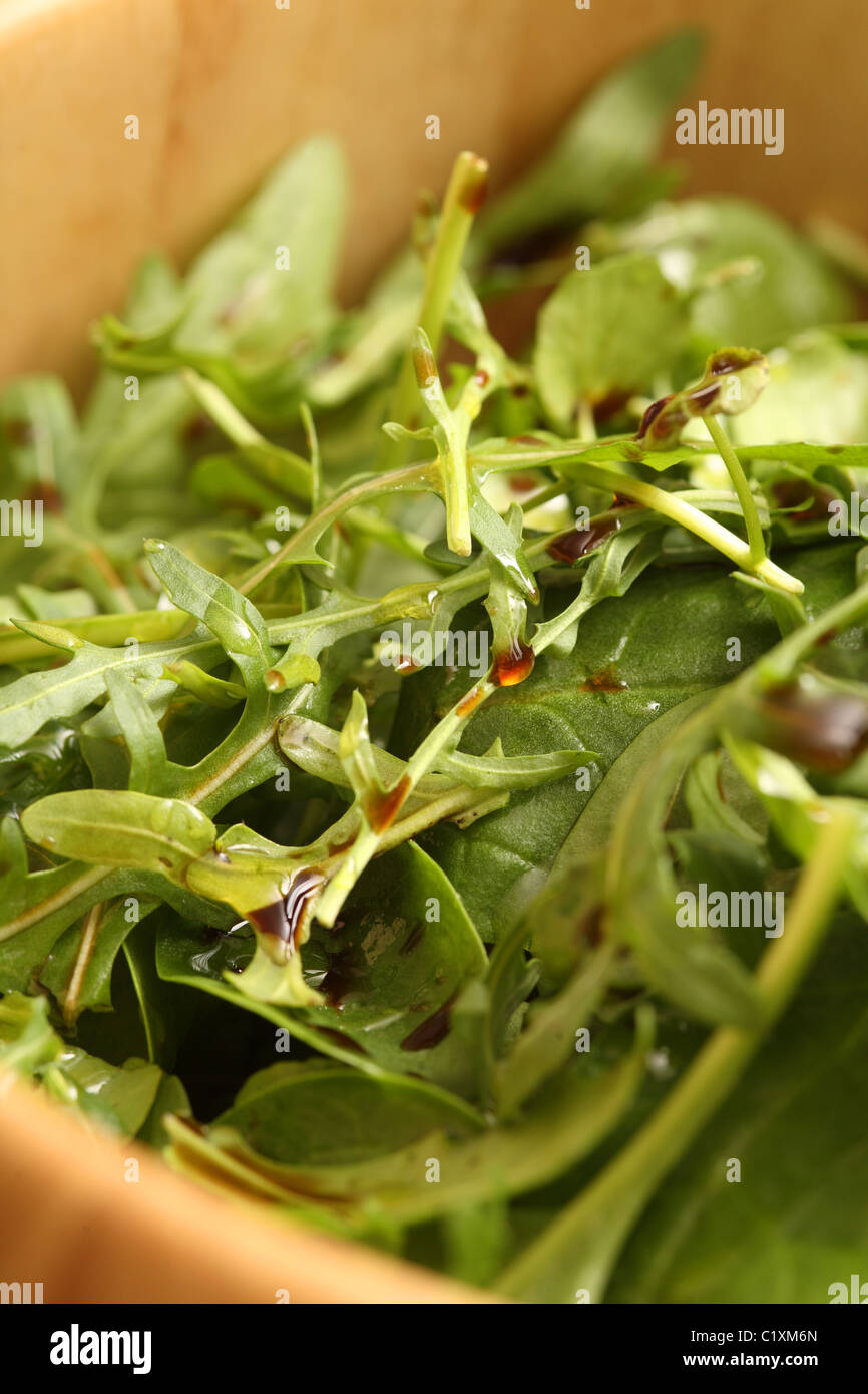 rocket salad in bowl with balsamic dressing Stock Photo - Alamy