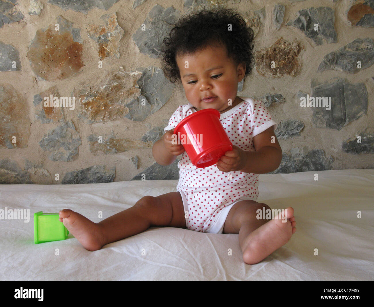 Baby playing with stacking shapes Stock Photo - Alamy