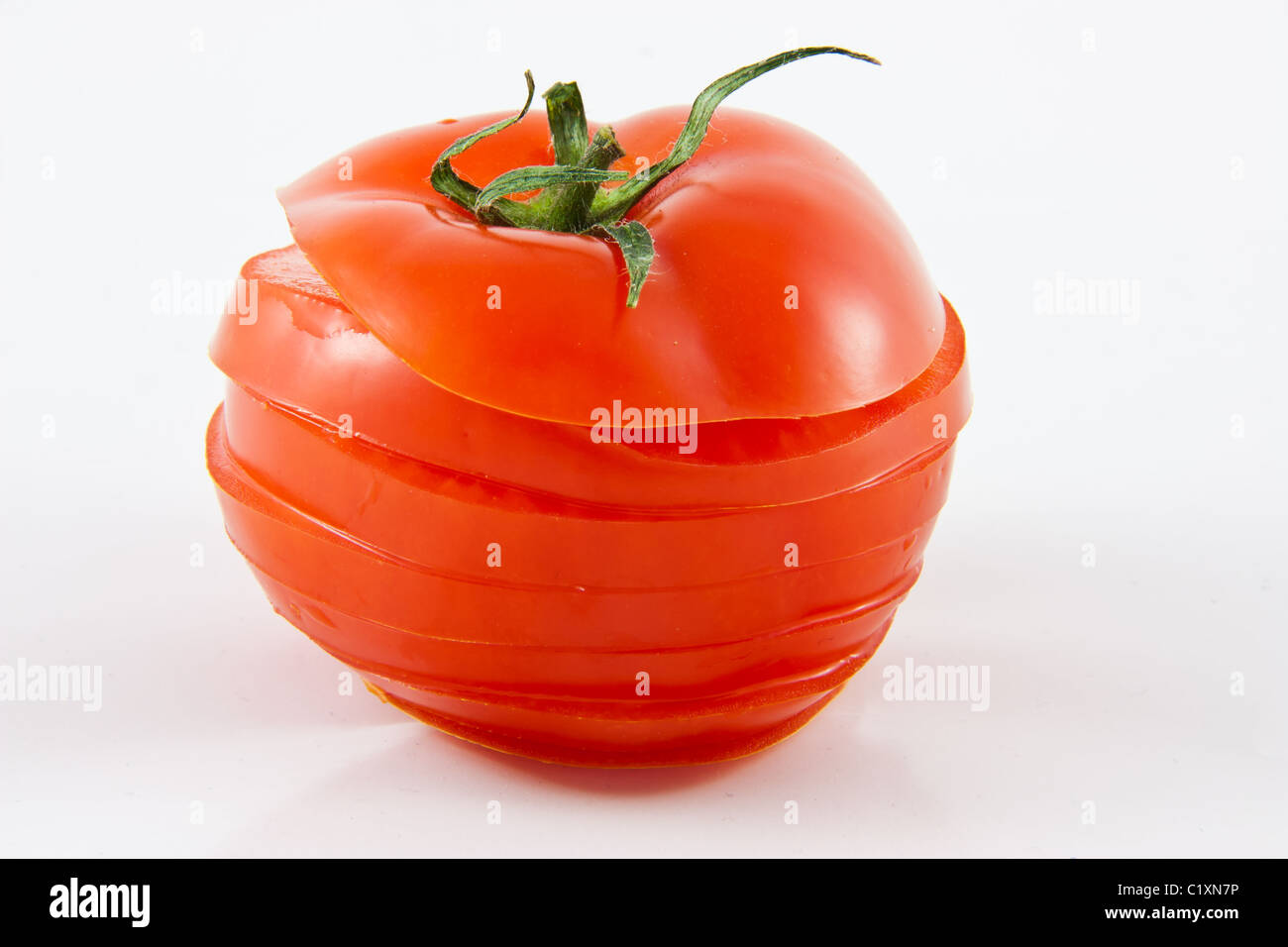 Picture of a single sliced tomatoe Stock Photo - Alamy