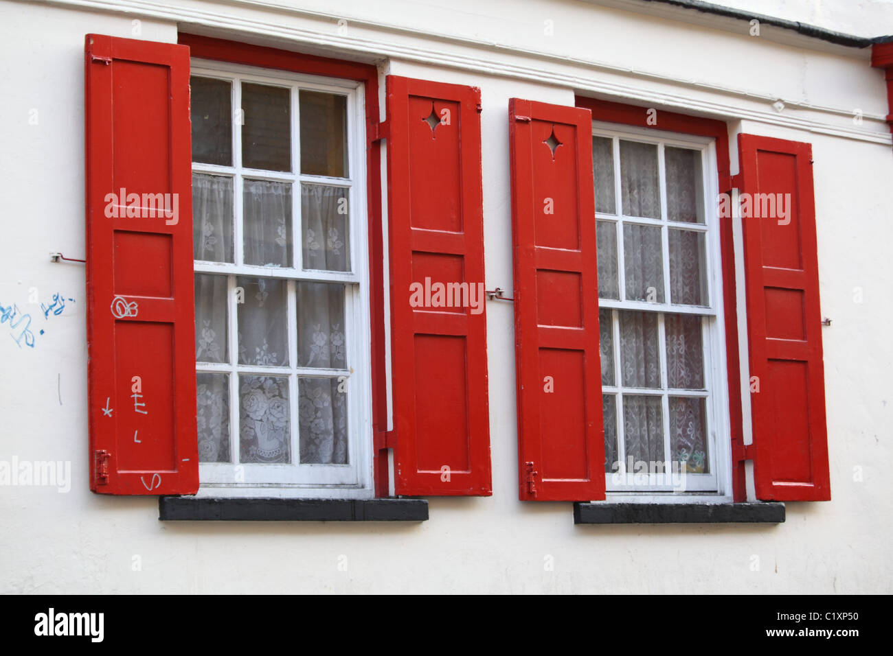 red shutters of windows Stock Photo - Alamy