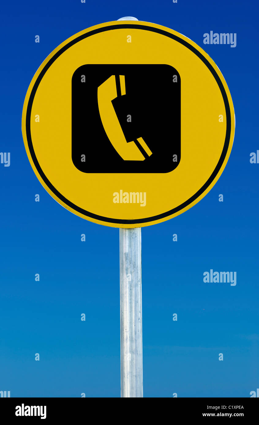 A telephone sign isolated on a blue graduated sky Stock Photo - Alamy