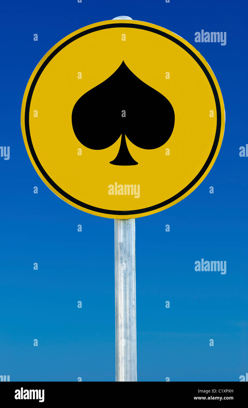 Spade sign on a yellow sign on a blue background Stock Photo - Alamy