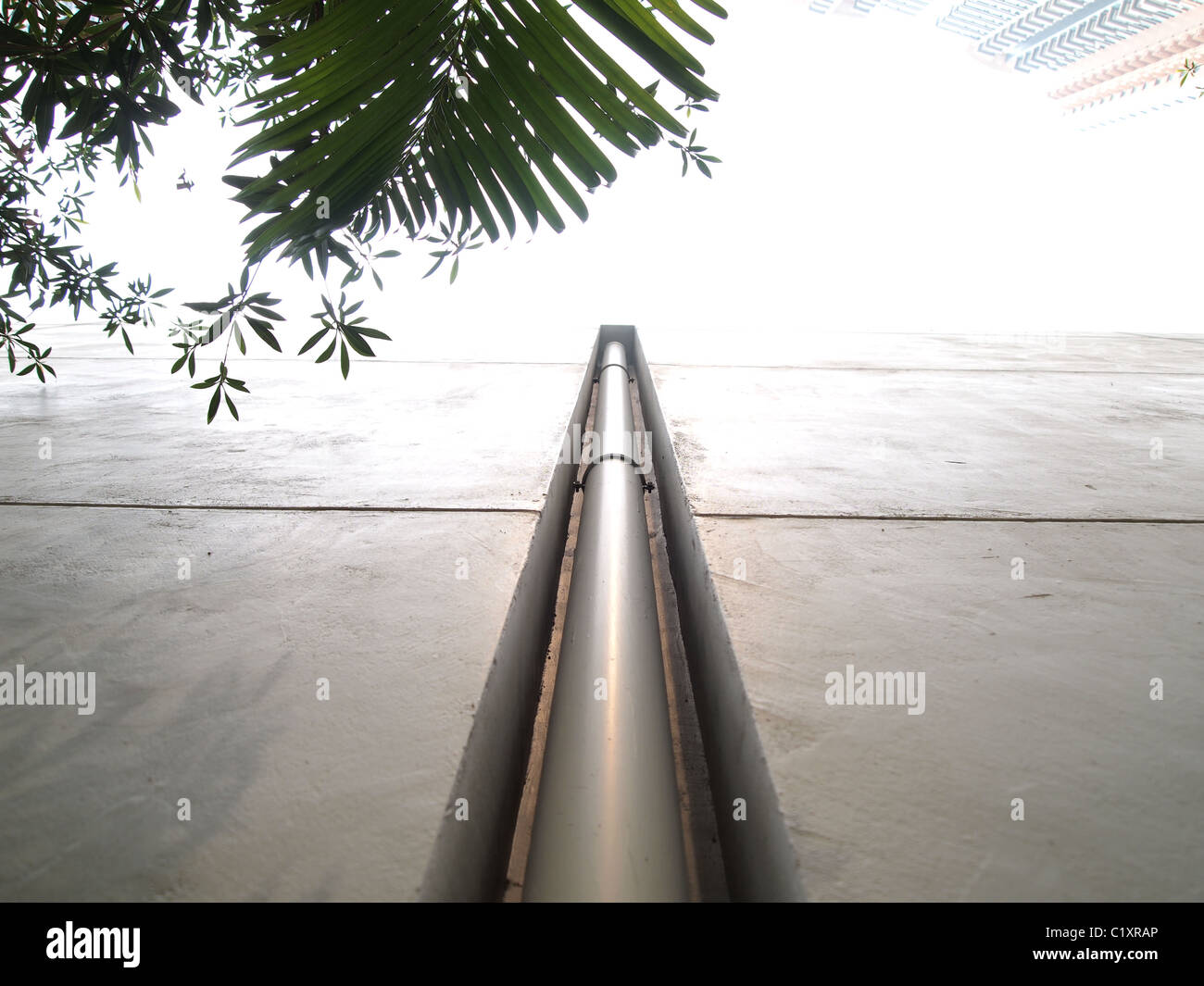 Pipe on wall, low angle view Stock Photo - Alamy