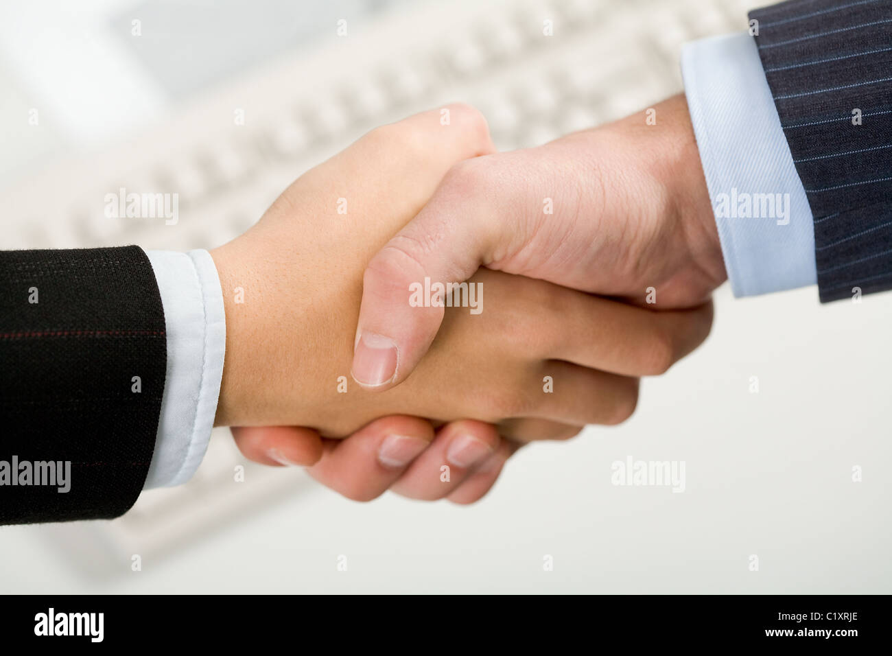 Photo of handshake of business partners after striking deal Stock Photo ...