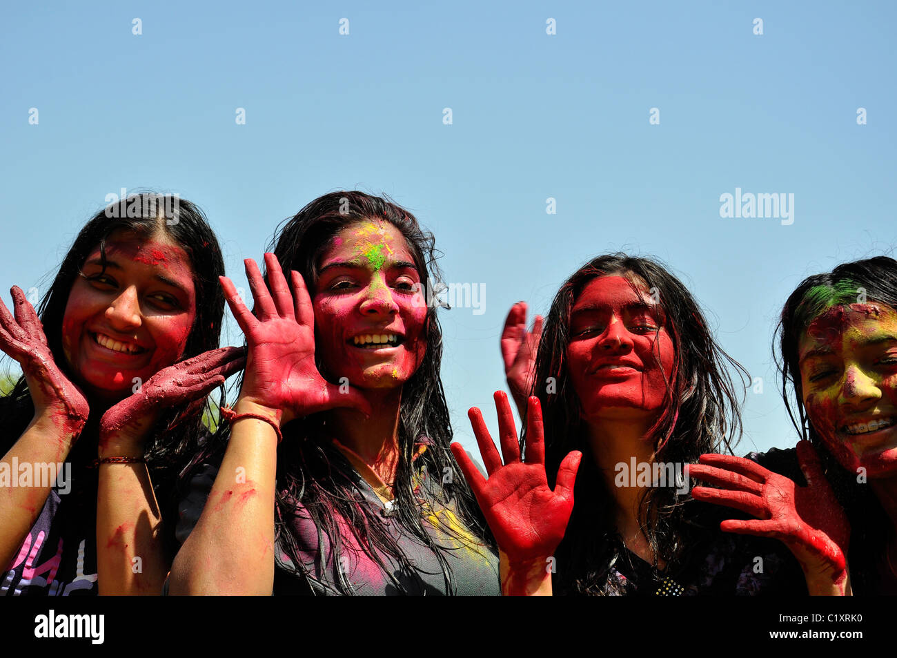 Girls playing holi Stock Photo - Alamy