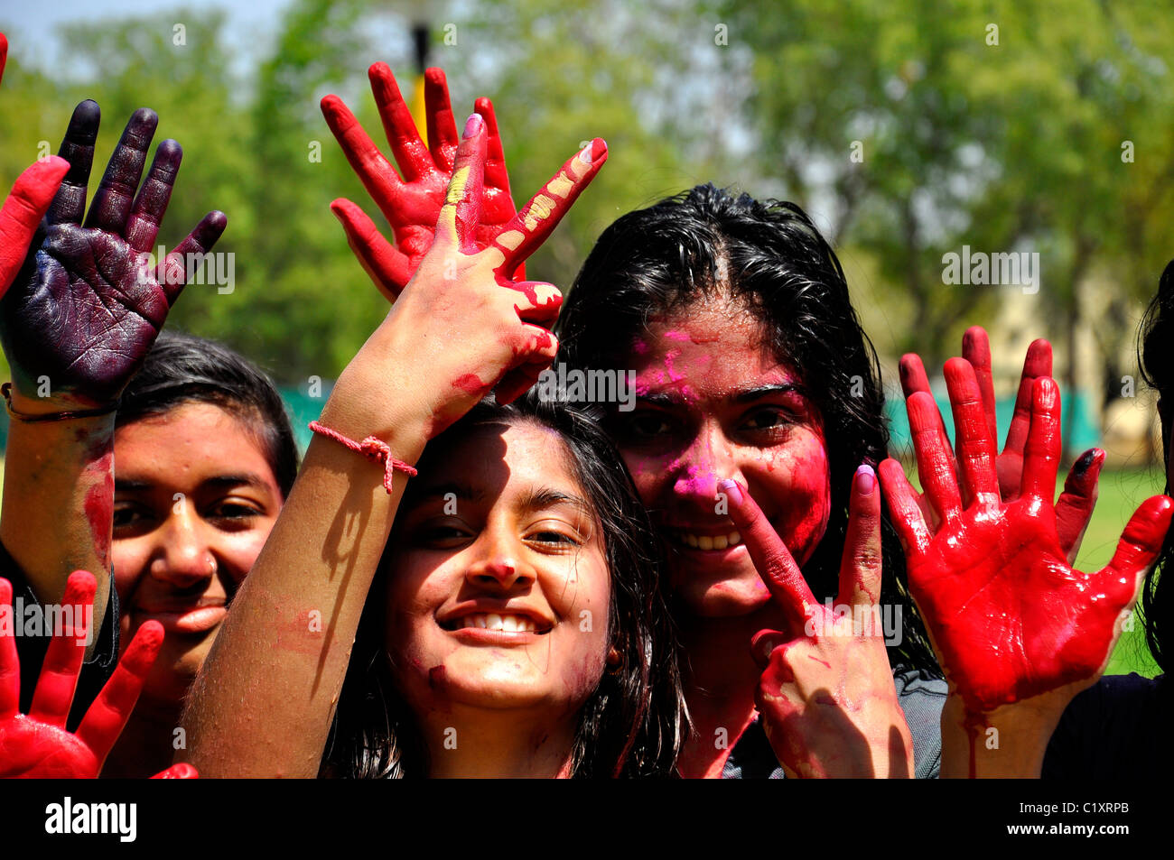 Girls playing holi Stock Photo - Alamy