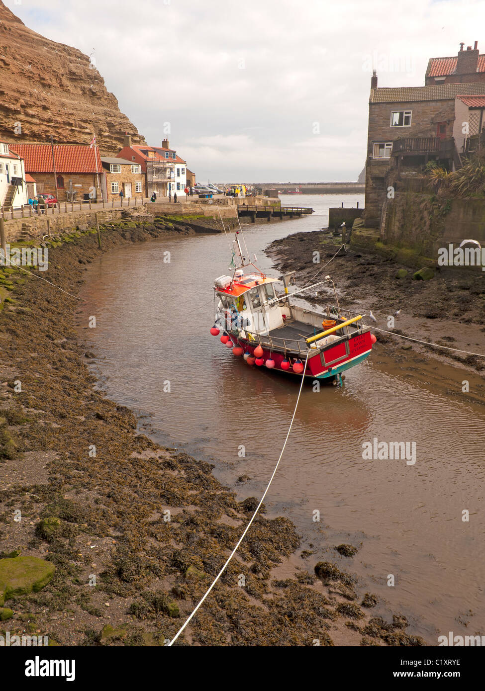 A fishing boat by Roxby Beck Staithes North Yorkshire Stock Photo - Alamy