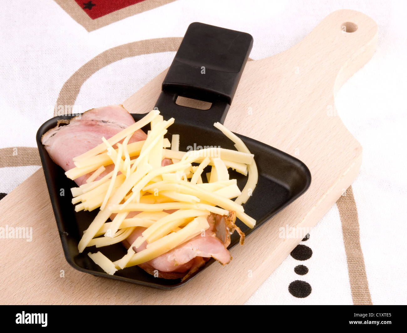 Raclette cheese on wooden board hi-res stock photography and images - Alamy
