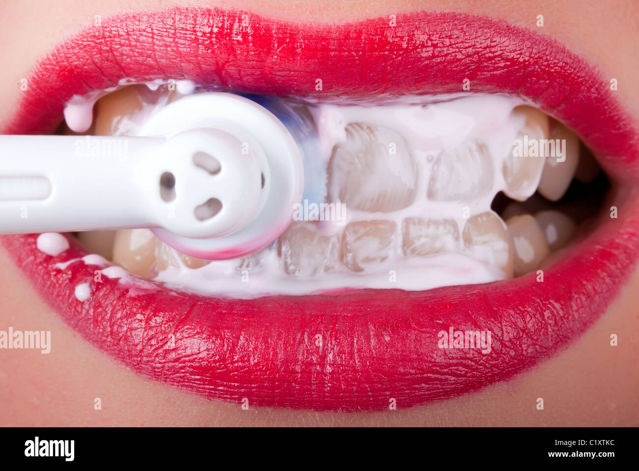 white teeth are brushed with an electric toothbrush Stock Photo - Alamy