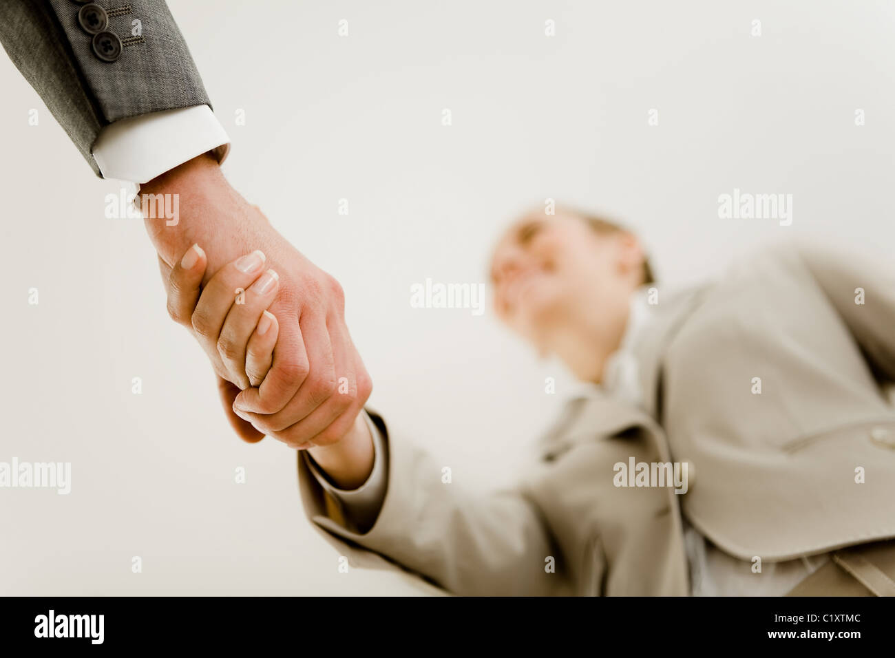 Photo of handshake of business partners after signing contract Stock ...