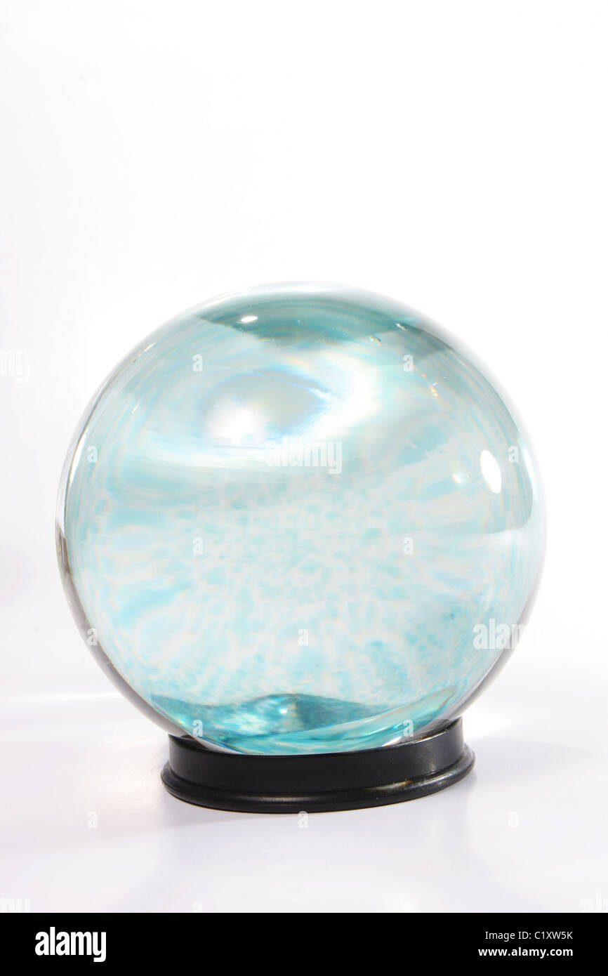 Crystal ball with swirling blue shapes Stock Photo - Alamy