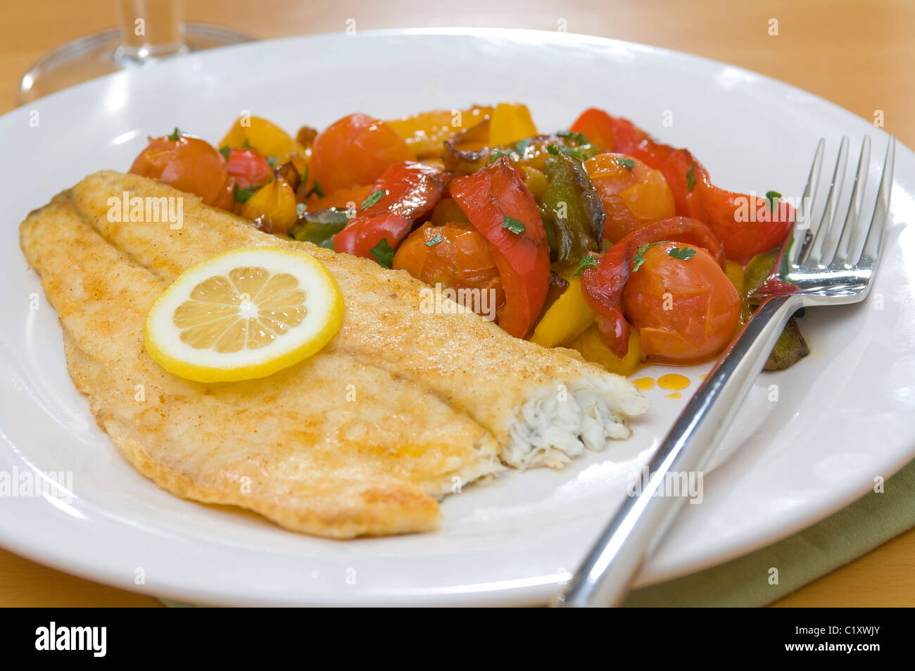 Lightly dusted plaice fillet with roasted salad Stock Photo - Alamy