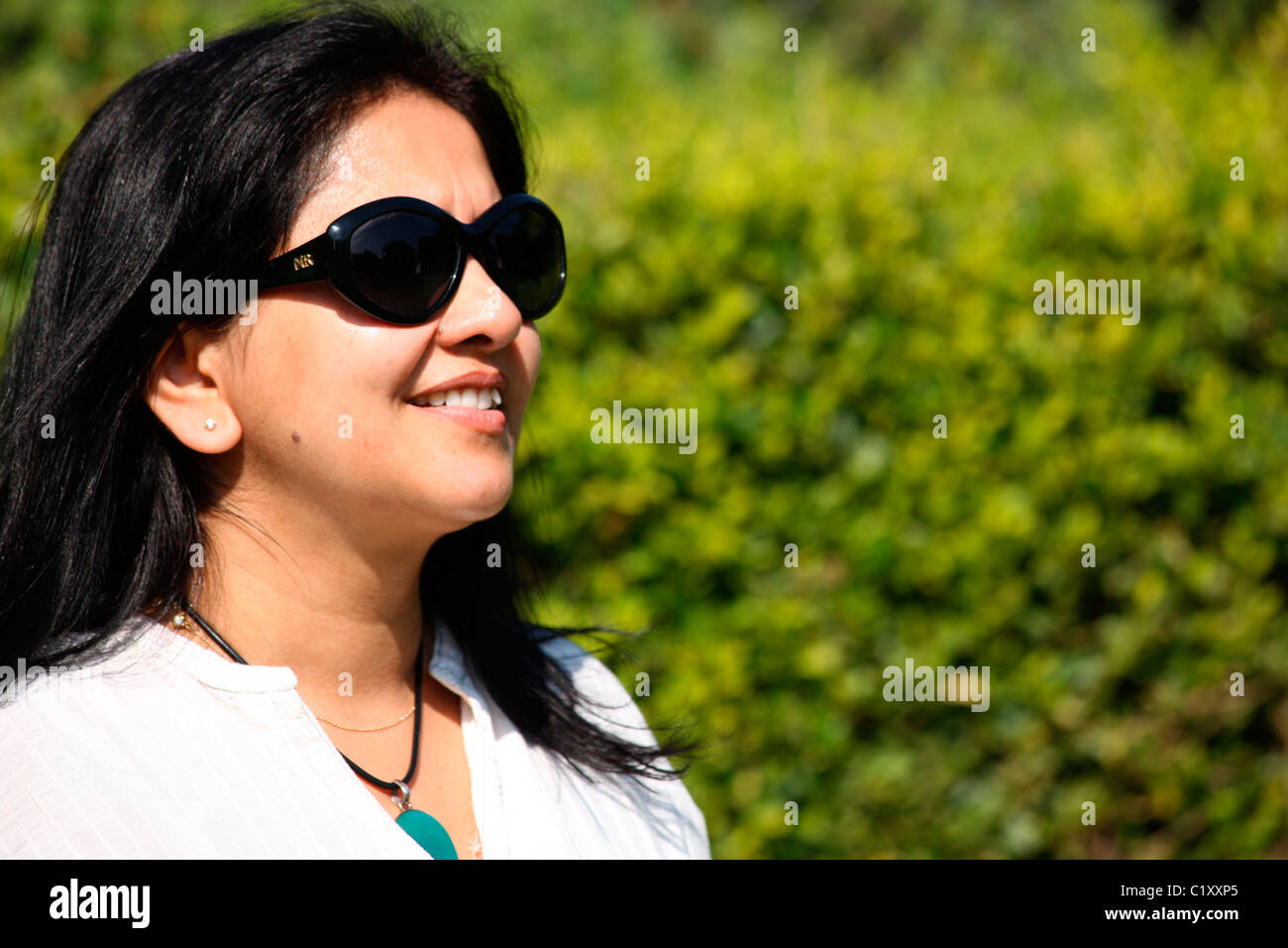 Indian girl smiling - portrait Stock Photo - Alamy