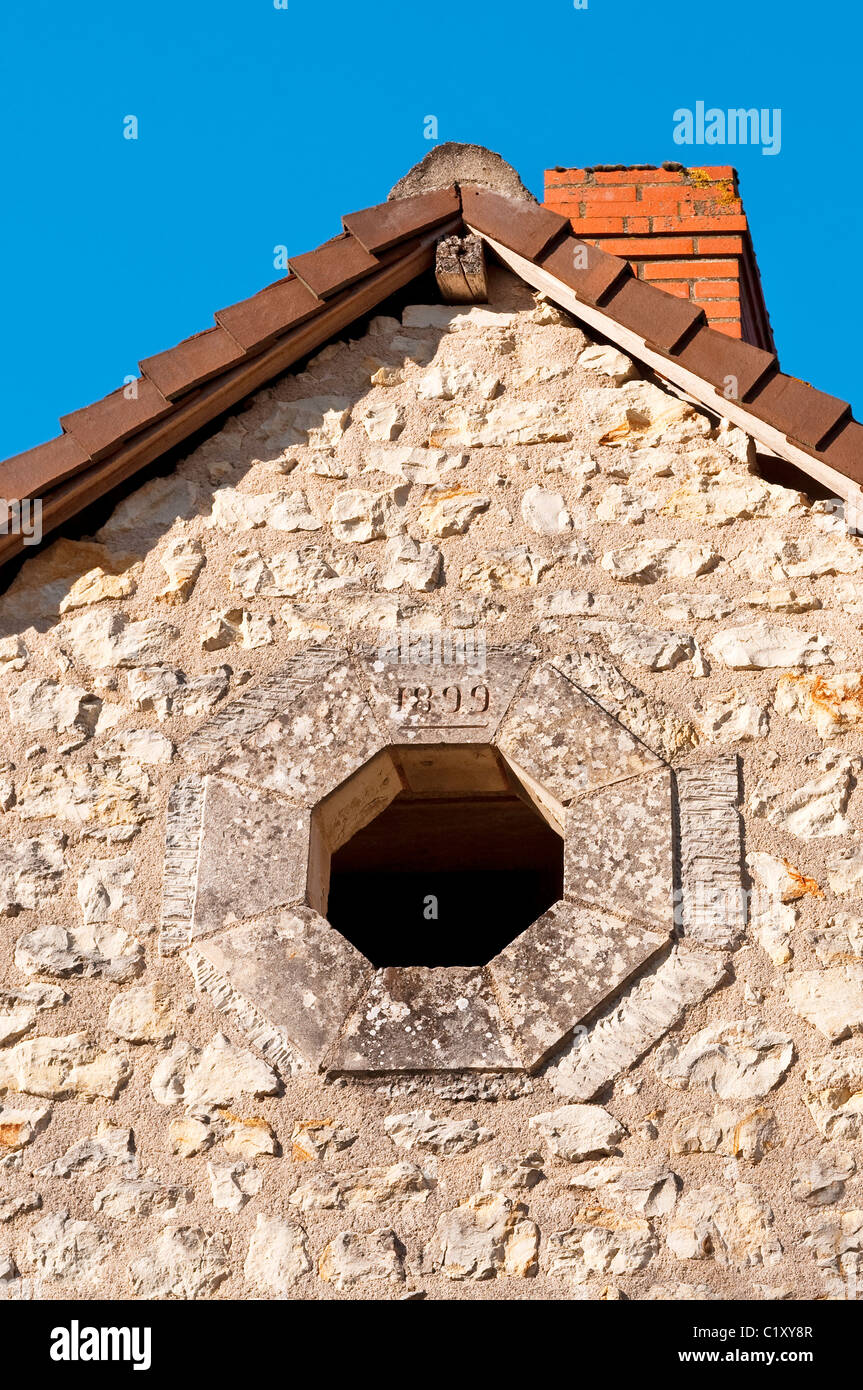 Octagonal window with 1899 inscribed date stone - France Stock Photo ...