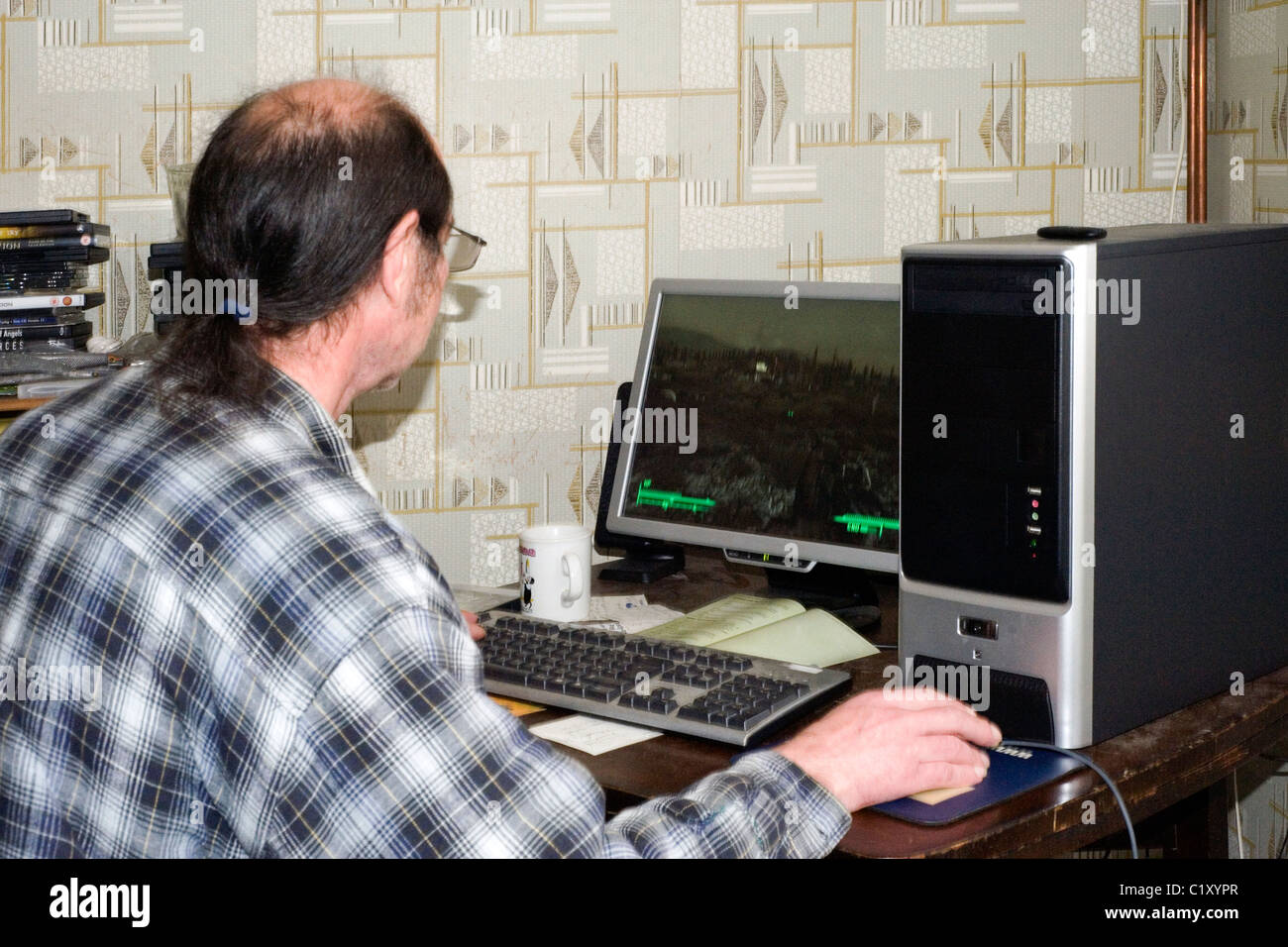 Older man playing computer game hi-res stock photography and images - Alamy