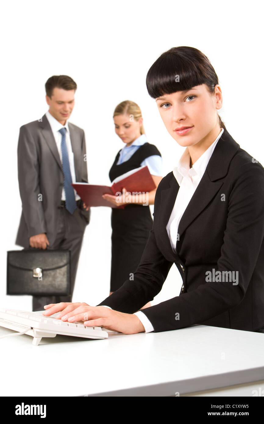 Portrait of smart secretary looking at camera on background of ...
