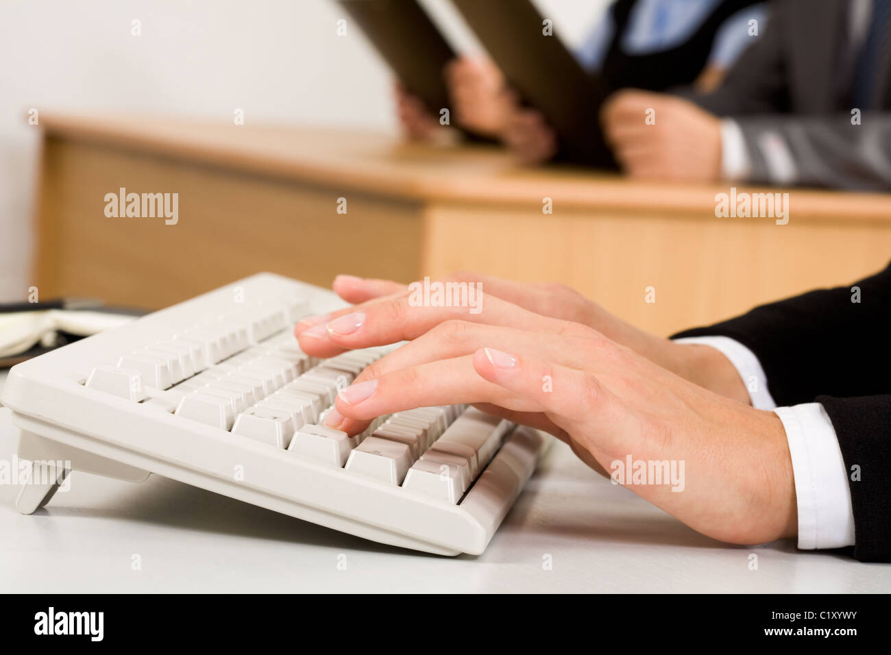 Image of female’s hands pushing buttons of computer keyboard in office ...
