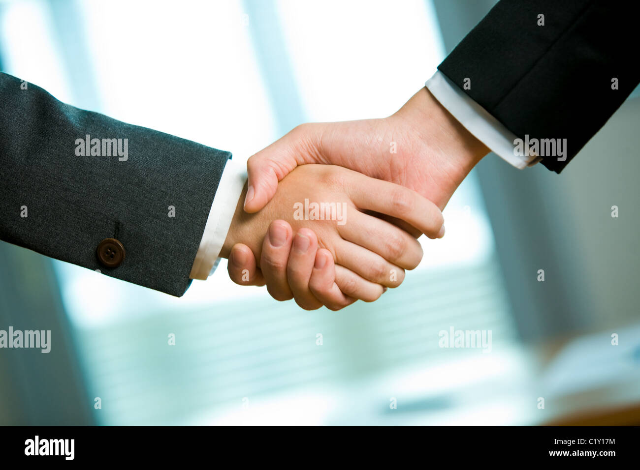 Photo of handshake of business partners after striking deal Stock Photo ...
