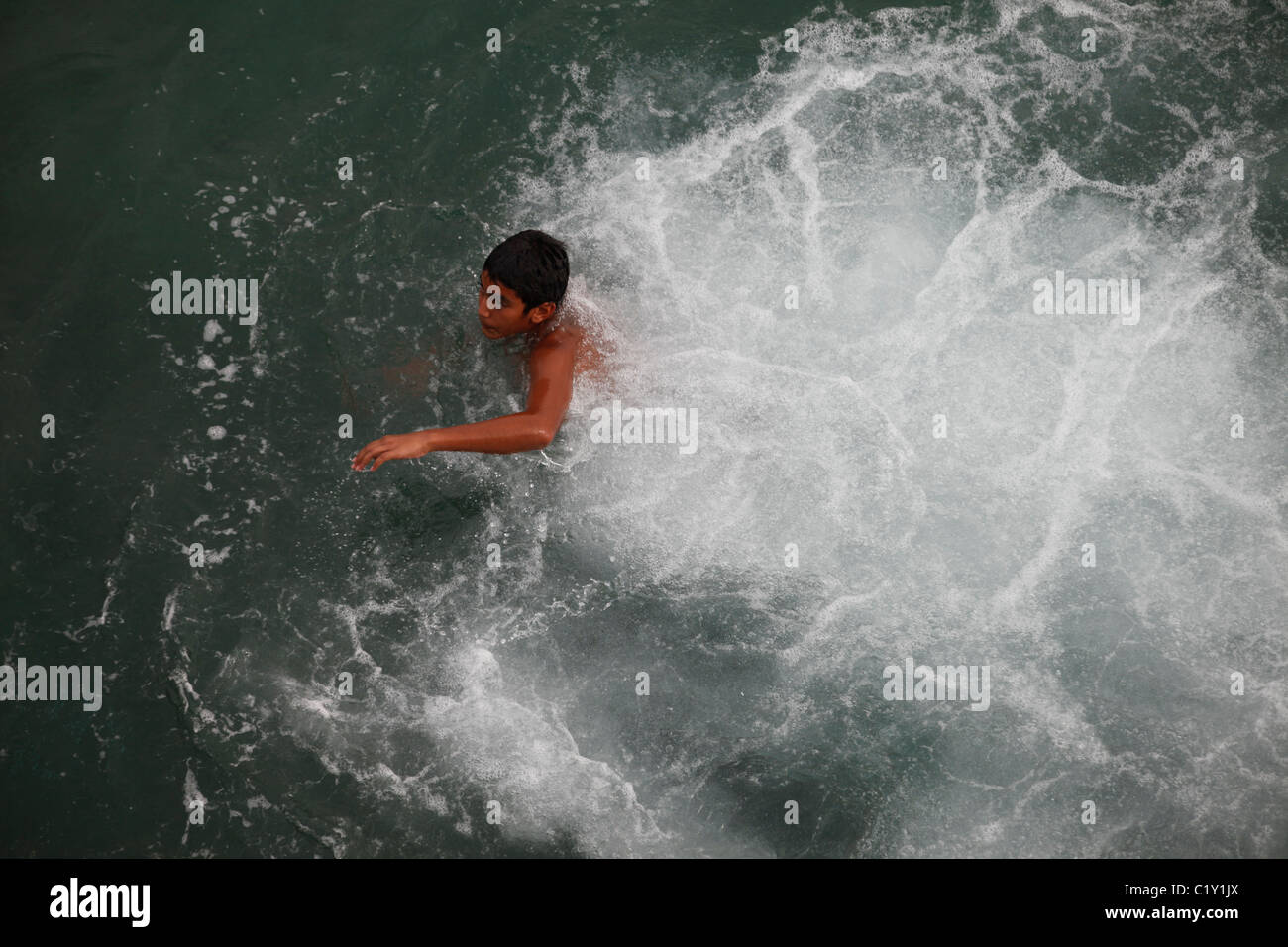 A swimming boy in the mediterranean sea Stock Photo - Alamy