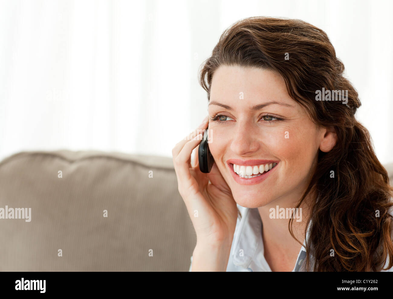 Beautiful woman speaking on the phone Stock Photo - Alamy