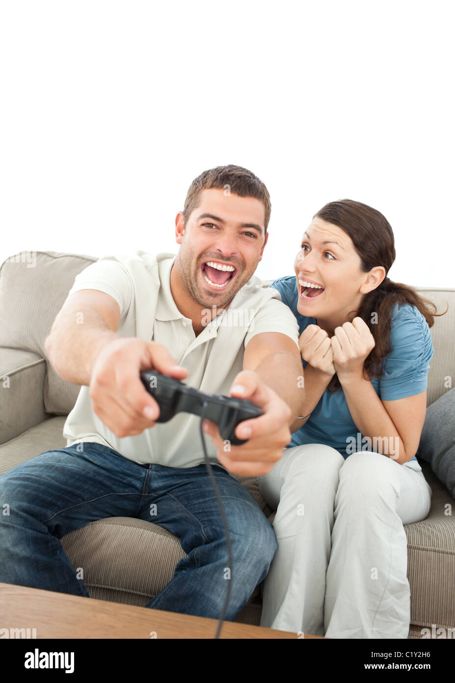 Cheerful woman encouraging her boyfriend playing video game Stock Photo ...