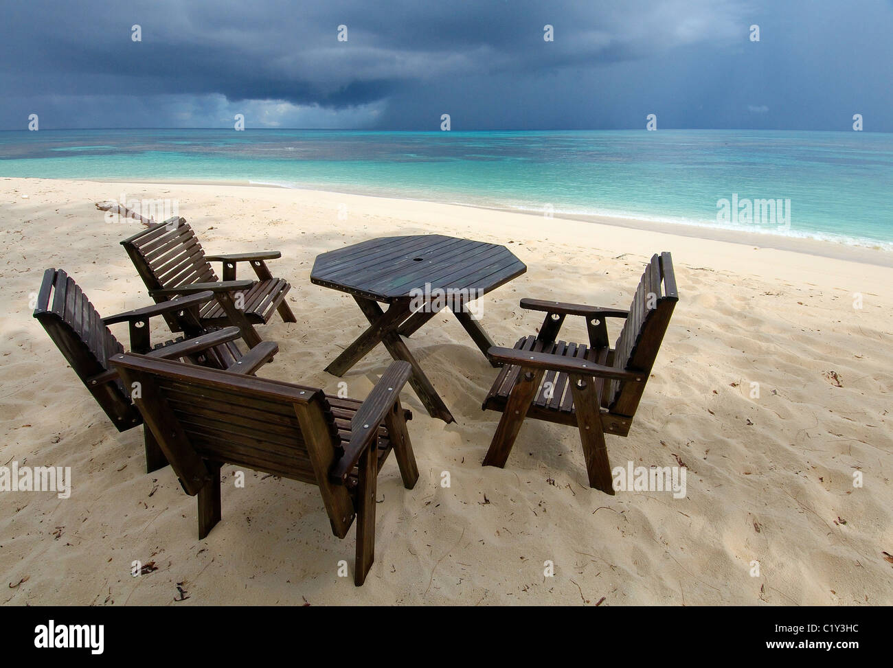 The wooden table and chairs on a beach Stock Photo - Alamy