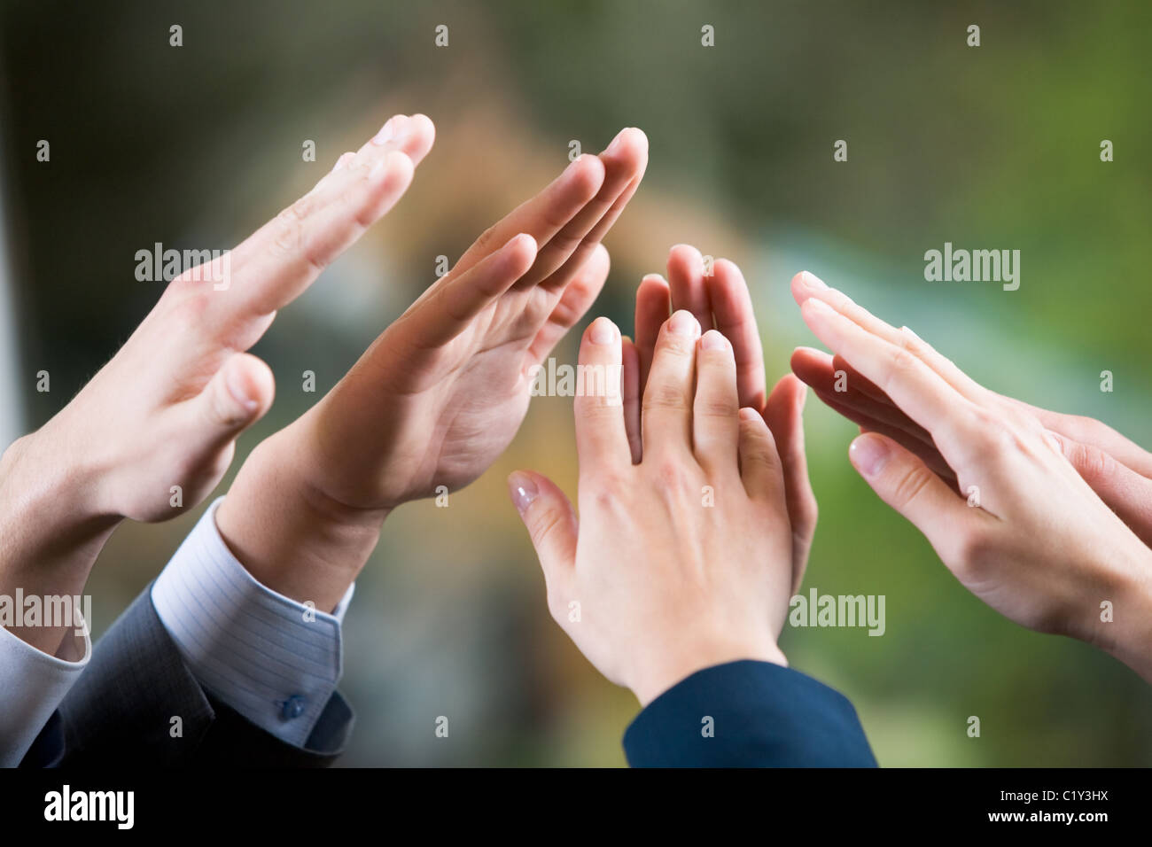 Close-up of several human hands making gesture of unity Stock Photo - Alamy