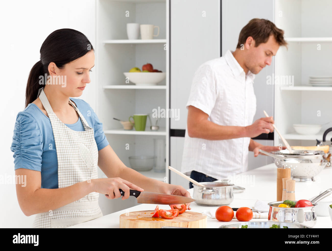 Couple preparing bolognese sauce and pasta together Stock Photo - Alamy
