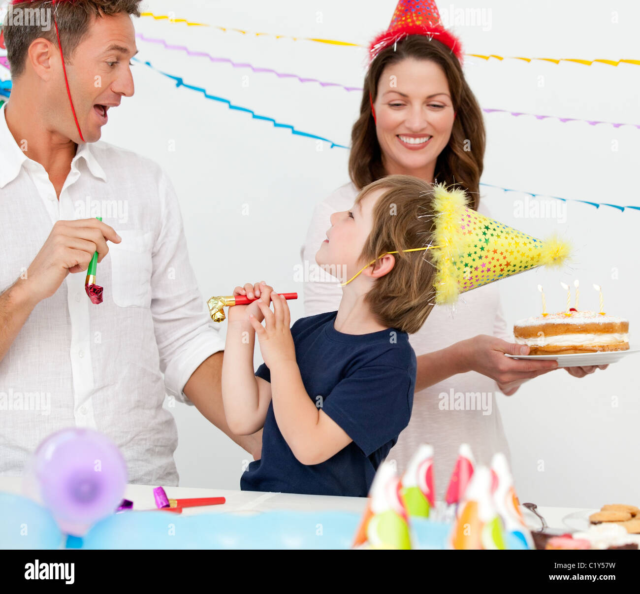 Happy family celebrating little boy Stock Photo - Alamy