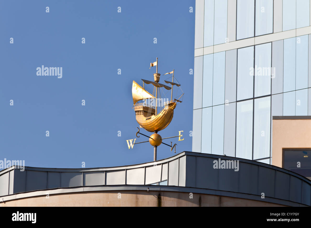 a golden ship sculpture on the roof Stock Photo - Alamy
