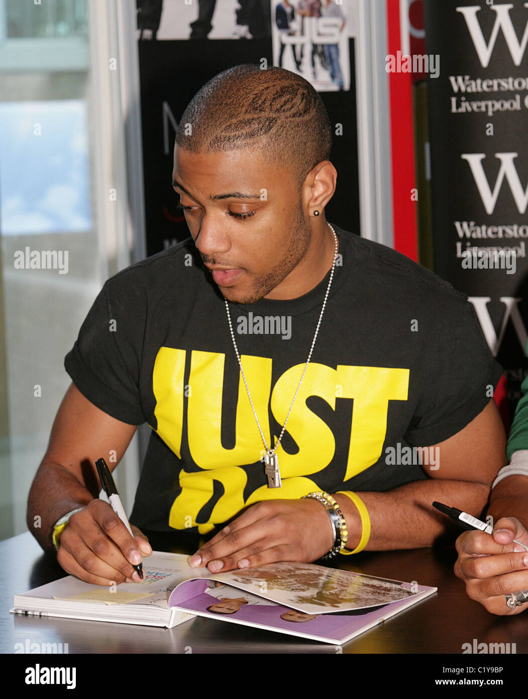 Jonathan 'JB' Gill JLS signing copies of their new book 'JLS - Our ...
