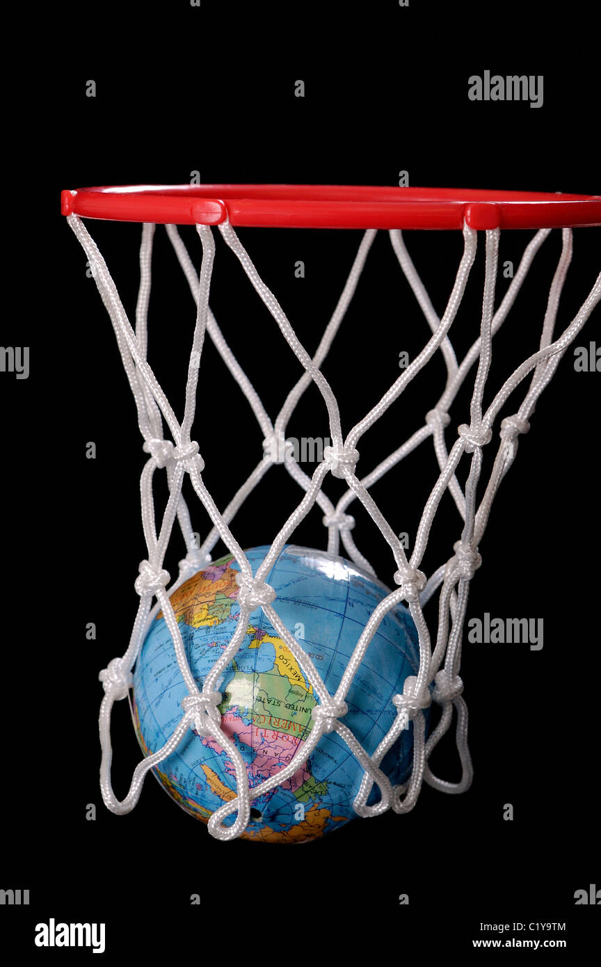 This stock photo shows a basket being made in a basketball hoop with ...