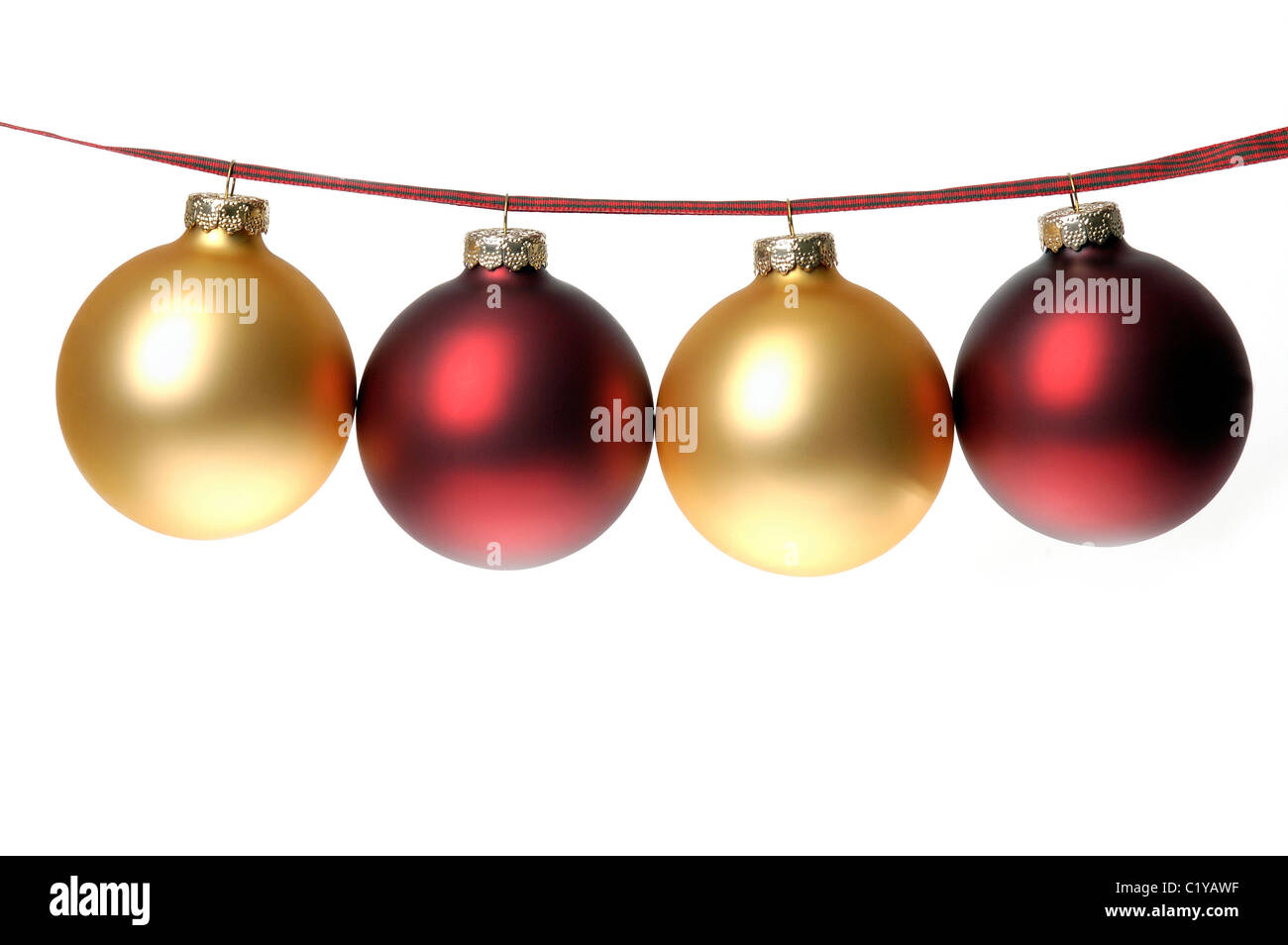 This stock photo has a white background with a string of red and gold ...