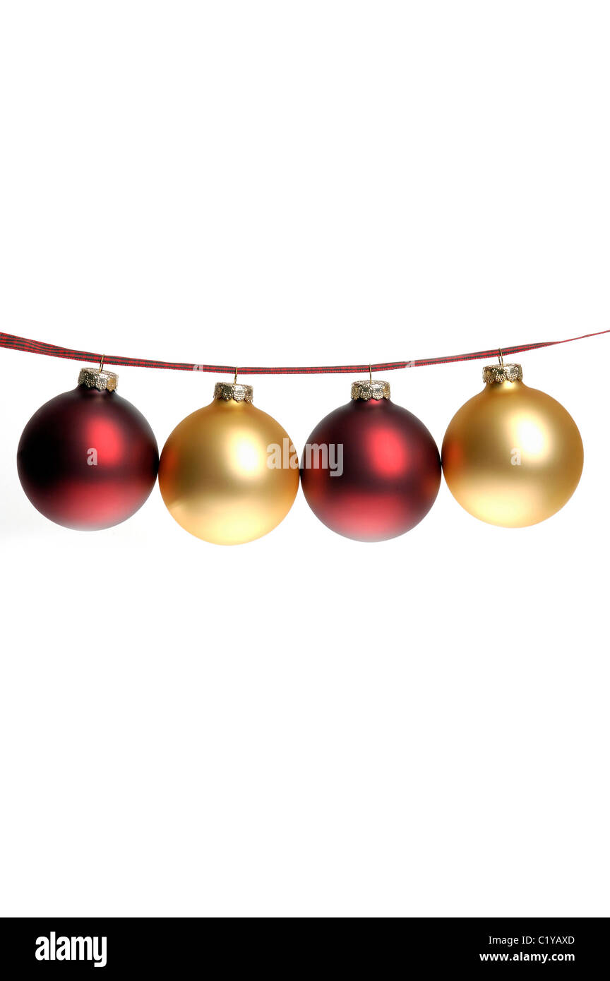 This stock photo has a white background with a string of red and gold ...