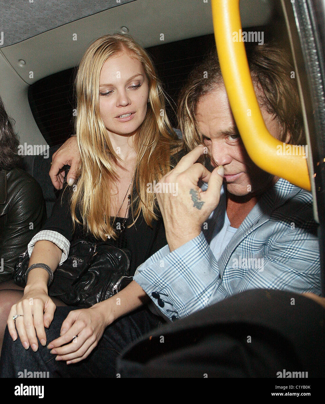 Mickey Rourke leaving Mahiki nightclub with a mystery blonde London ...