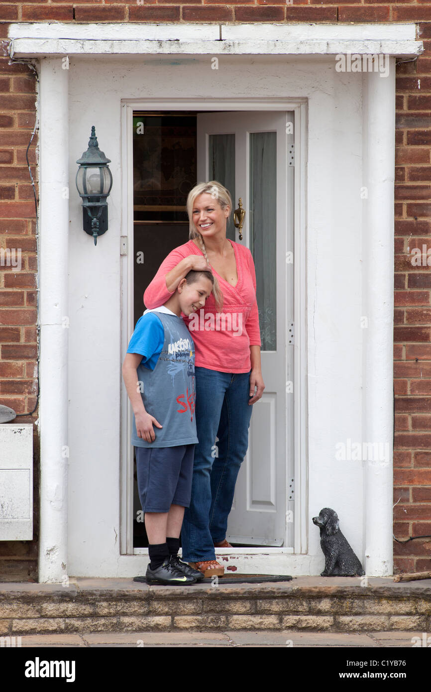 kid boy child running home mother Stock Photo - Alamy