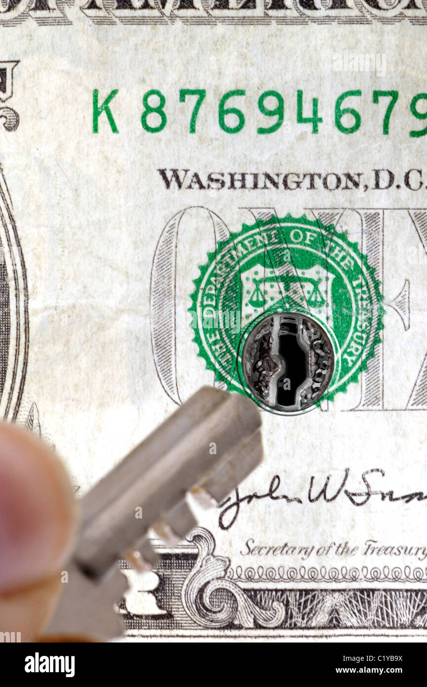 This stock photo shows a US dollar with keyhole and key, being locked ...