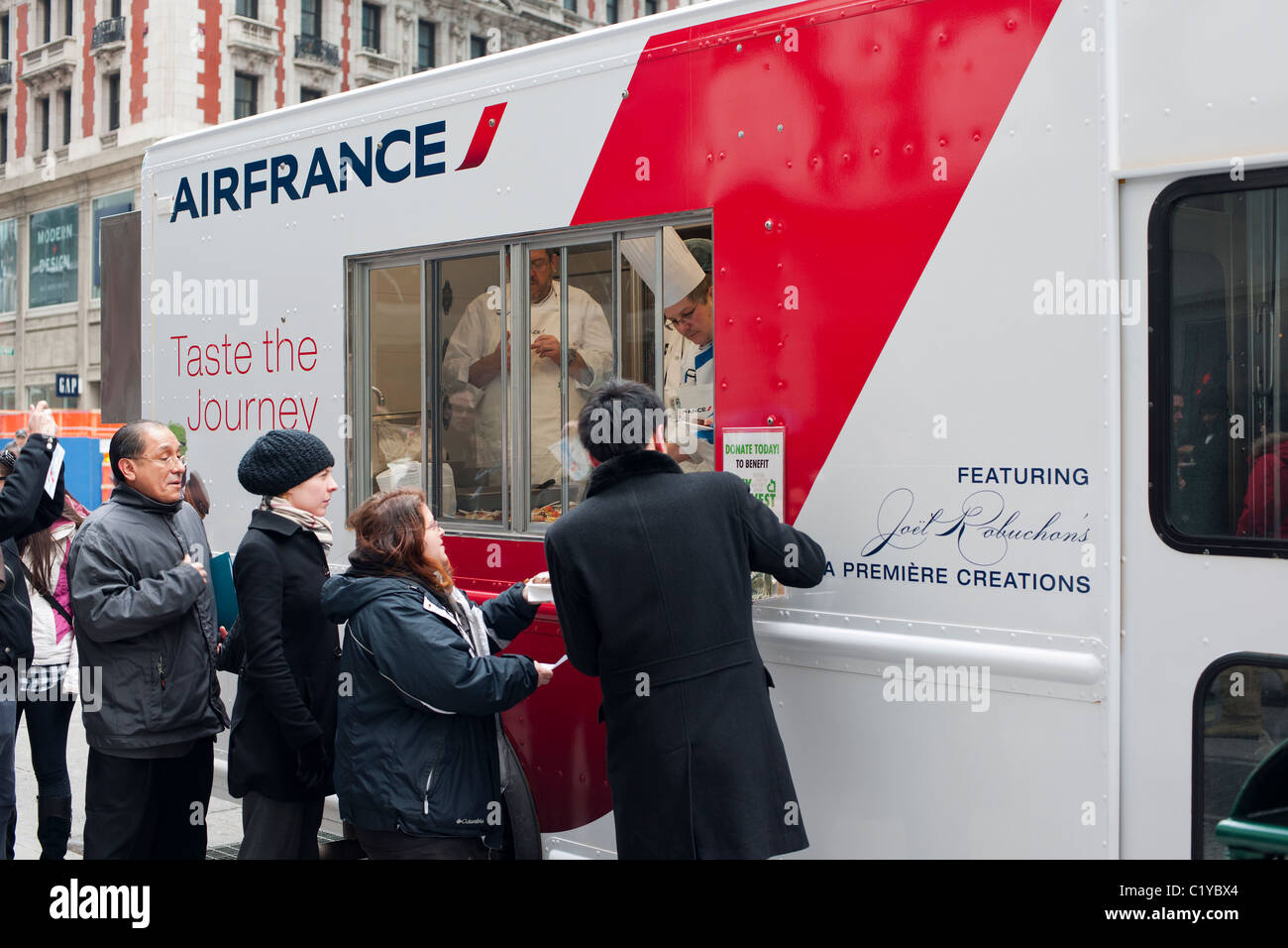 Foodies and passers-by take advantage of free Air France airline food ...