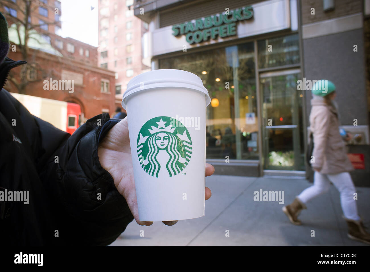 A Starbucks coffee cup with their new sans-typography logo Stock Photo ...