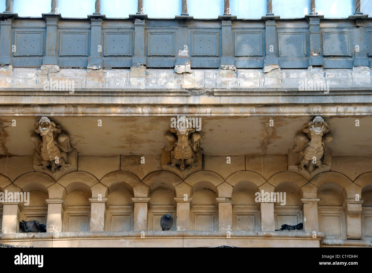 sculpture of the griffin as a balcony decoration Stock Photo - Alamy
