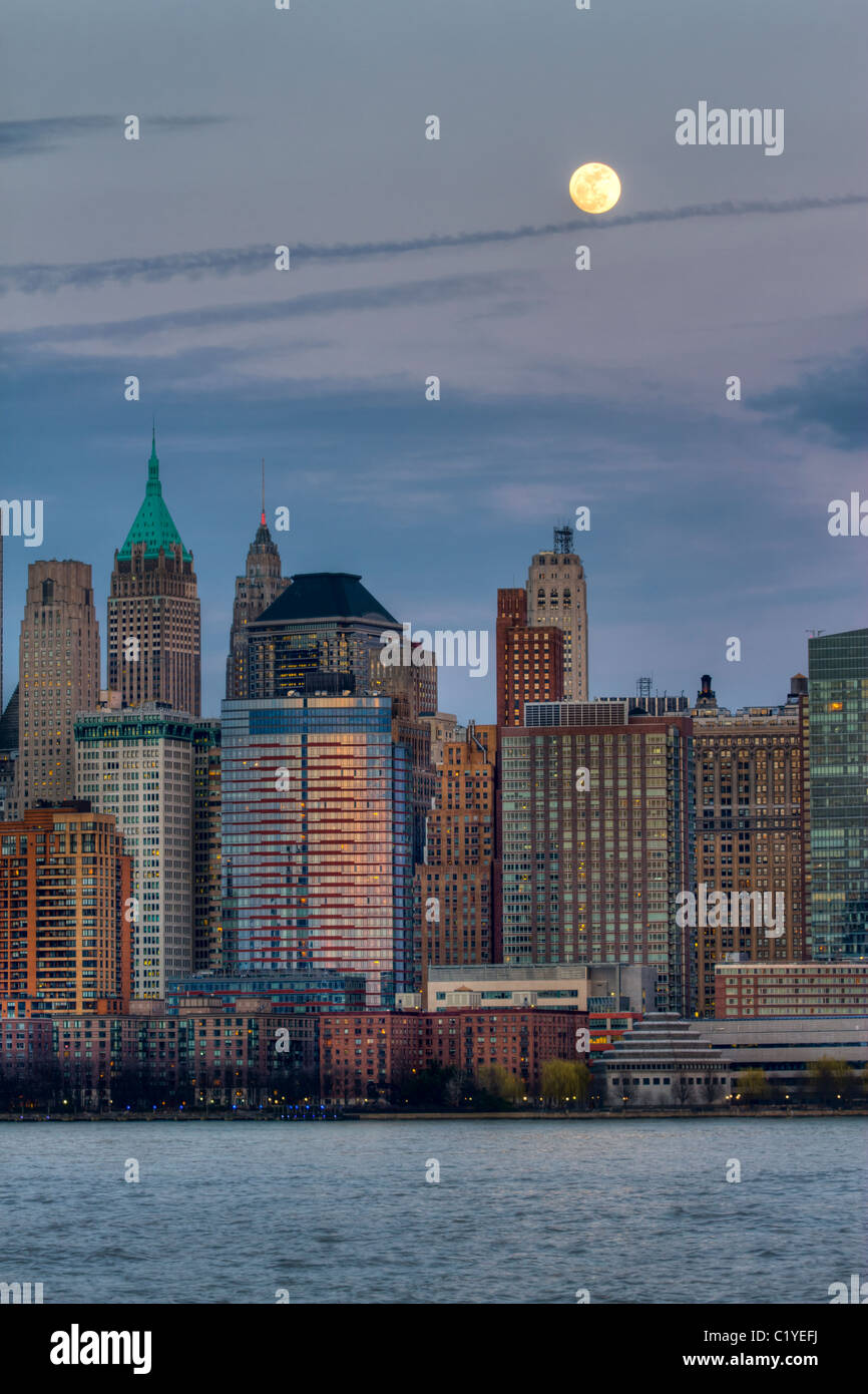 Full moon rising over lower Manhattan seen from New Jersey during the ...