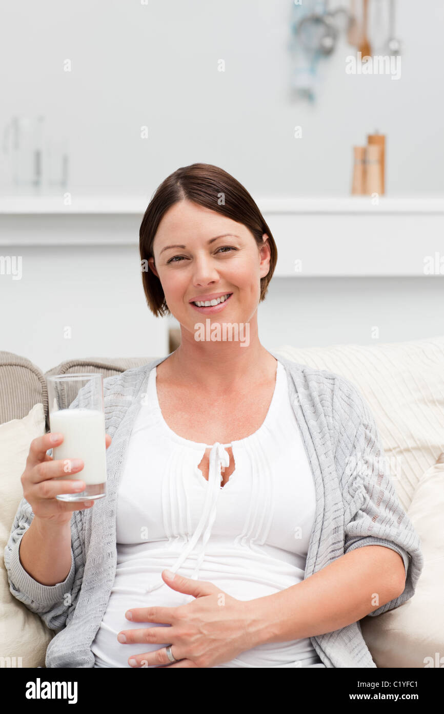 Pregnant woman drinking milk Stock Photo - Alamy