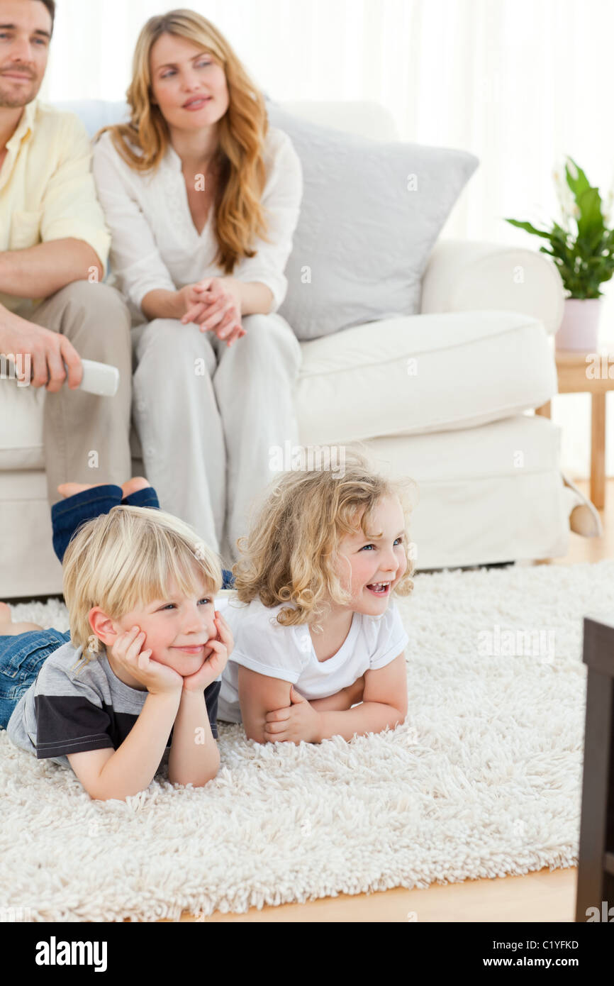 Adorable family watching tv Stock Photo - Alamy